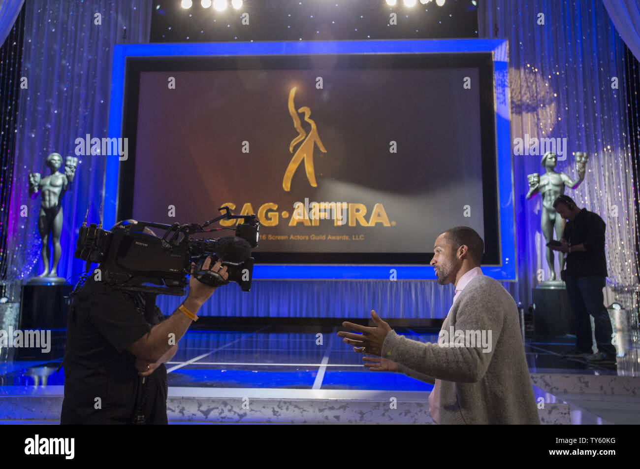 A news crew conducts an interview as preparations are underway for the ...