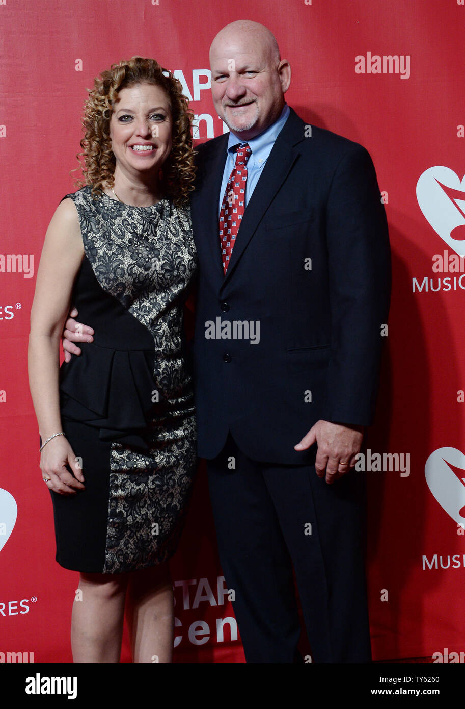 DNC chair Debbie Wasserman Shultz and her husband Steve Shultz arrive ...