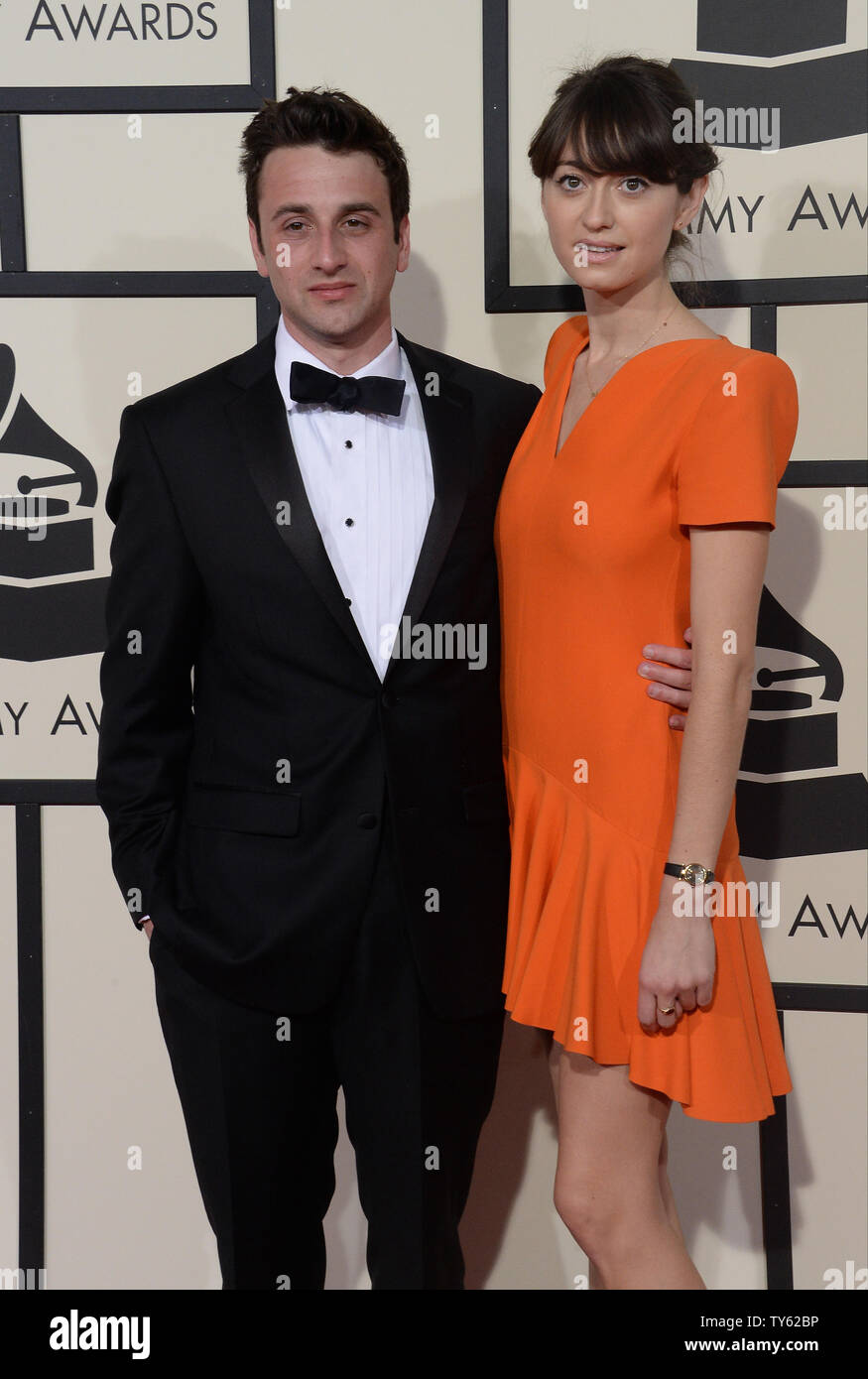 Justin Hurwitz, left, and guest arrive for the 58th annual Grammy ...
