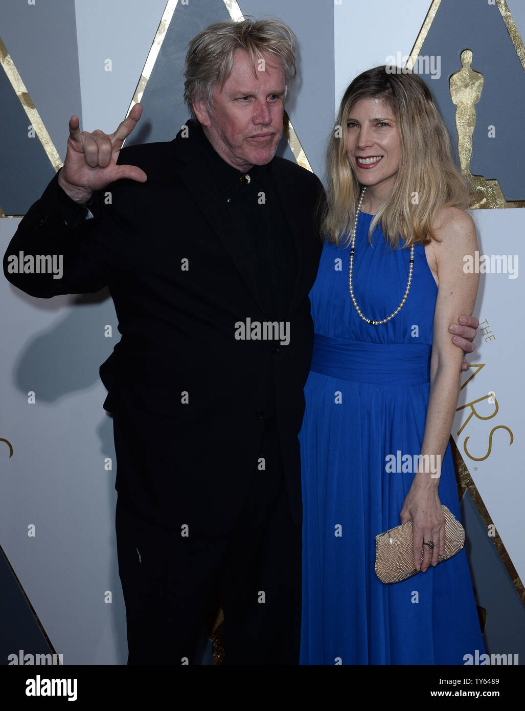 Gary Busey and Steffanie Sampson arrive on the red carpet for the 88th ...