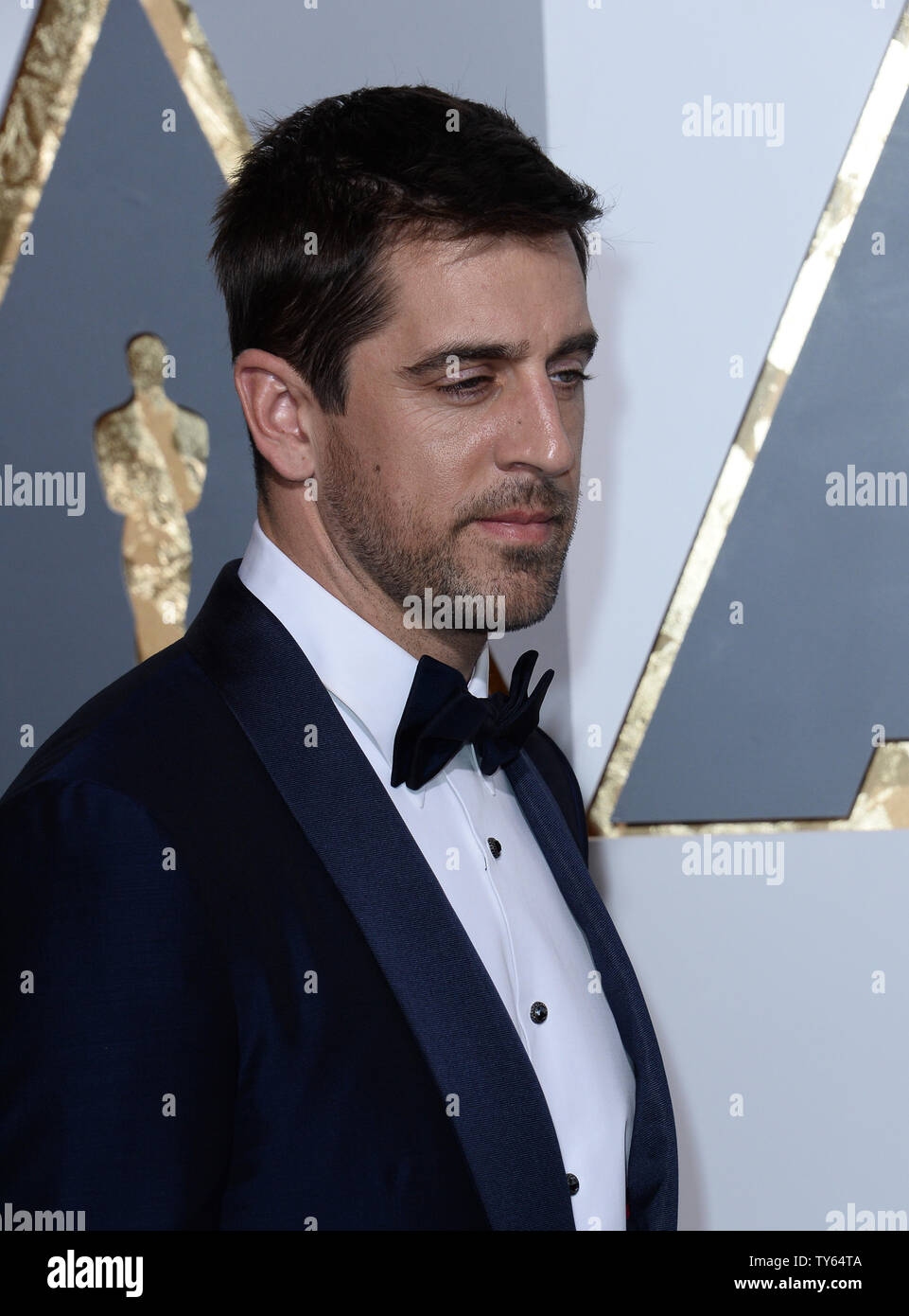 Aaron Rodgers arrives on the red carpet for the 88th Academy Awards, at ...