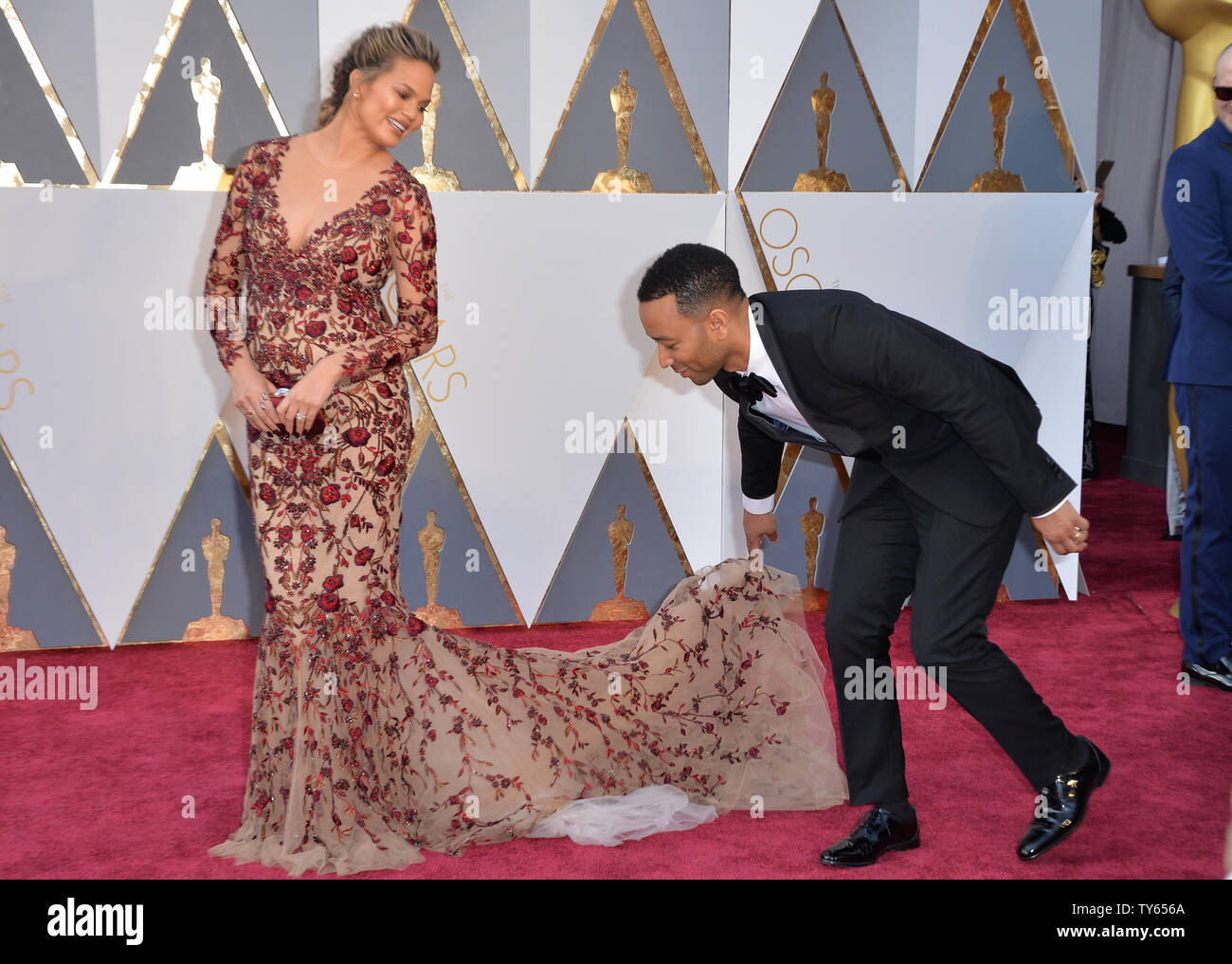 John Legend and Chrissy Teigen arrive on the red carpet for the 88th ...