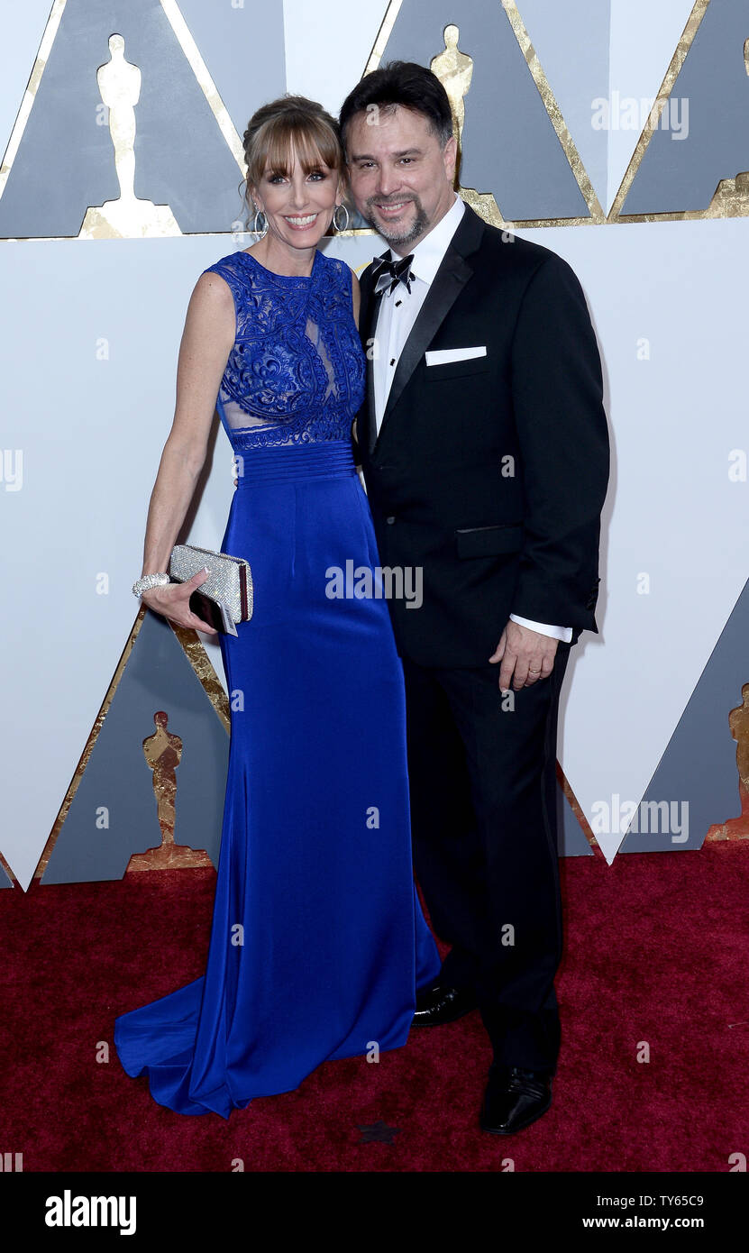 Sound mixer Frank A. Montano, right, and guest arrive on the red carpet ...