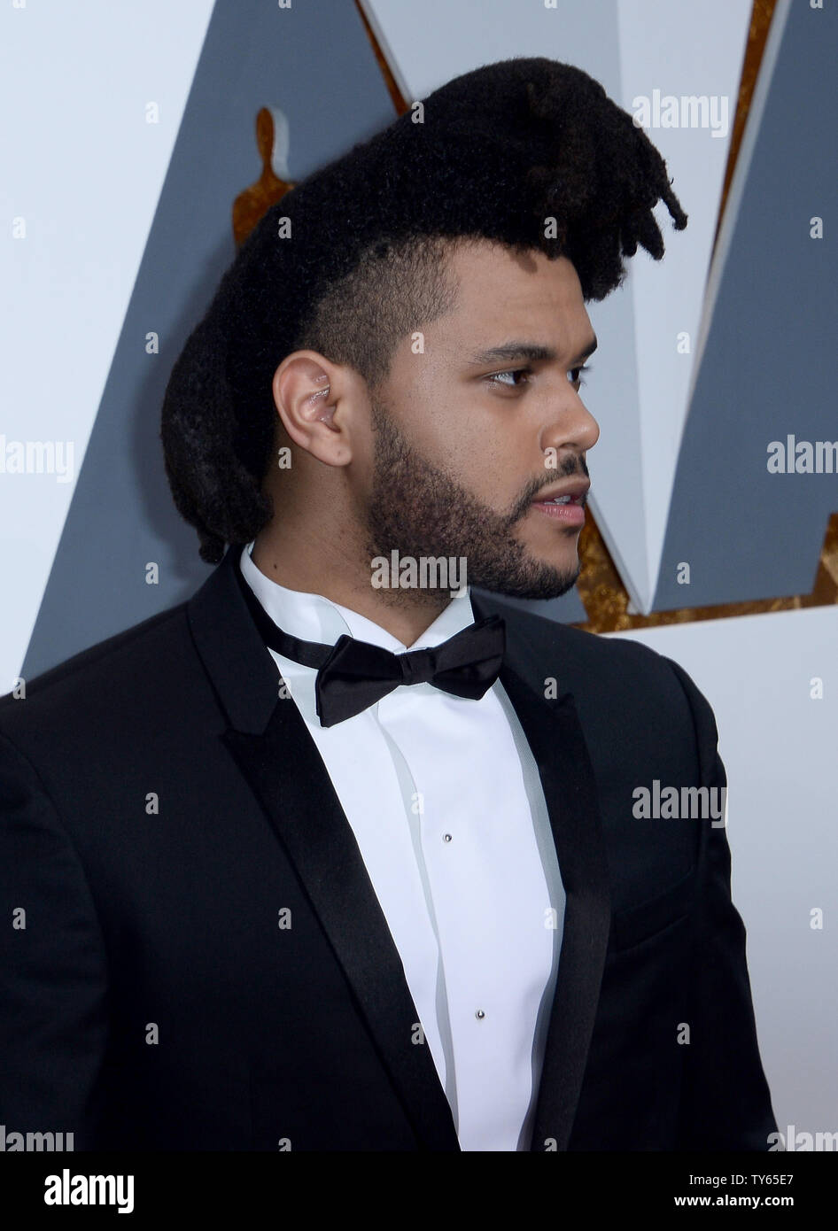 Singer The Weeknd arrives on the red carpet for the 88th Academy Awards ...