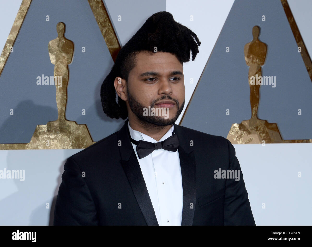 Singer The Weeknd arrives on the red carpet for the 88th Academy Awards ...
