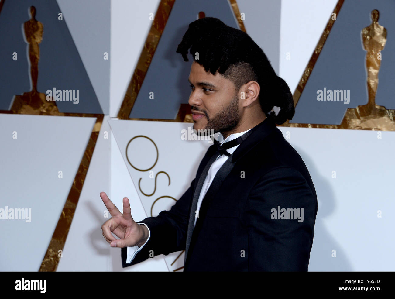 Singer The Weeknd arrives on the red carpet for the 88th Academy Awards ...