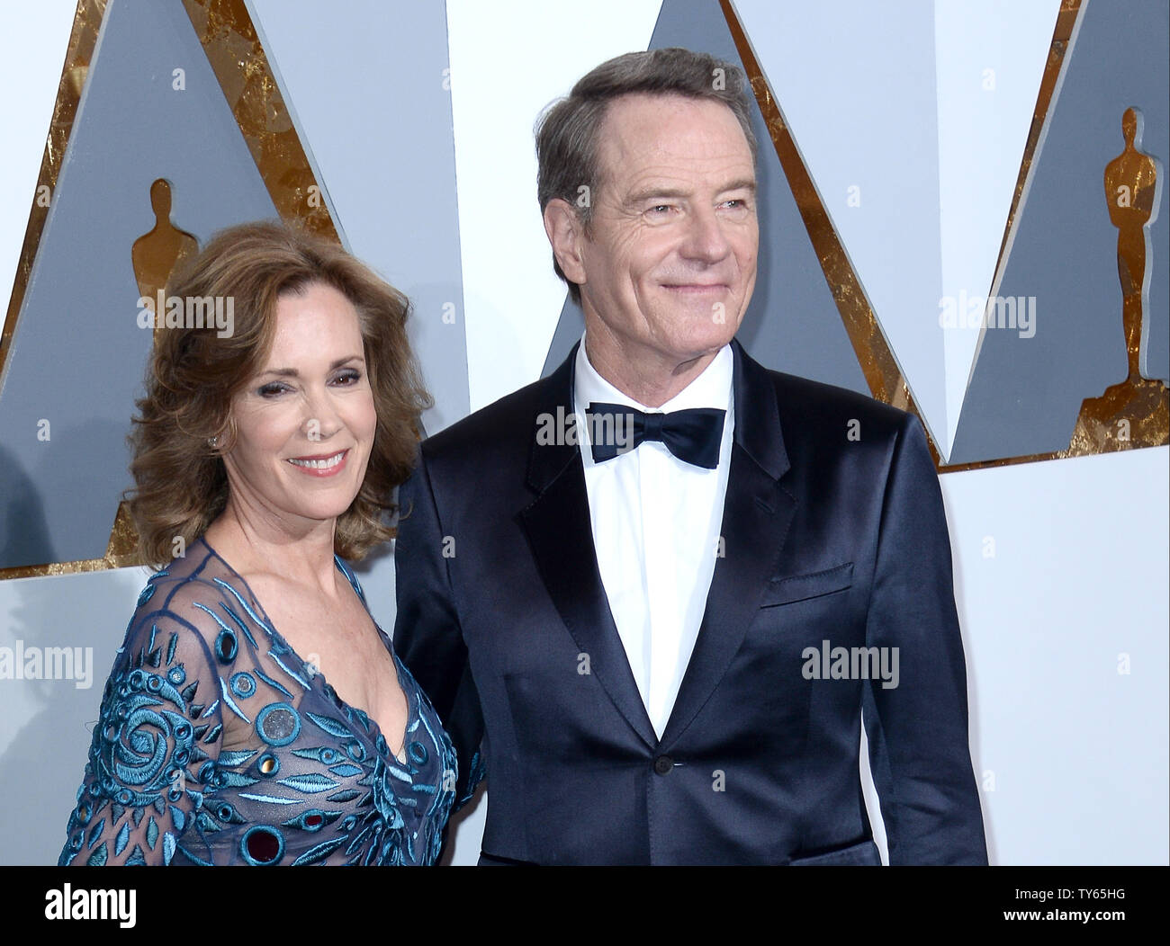 Robin Dearden, left, and actor Bryan Cranston arrive on the red carpet ...
