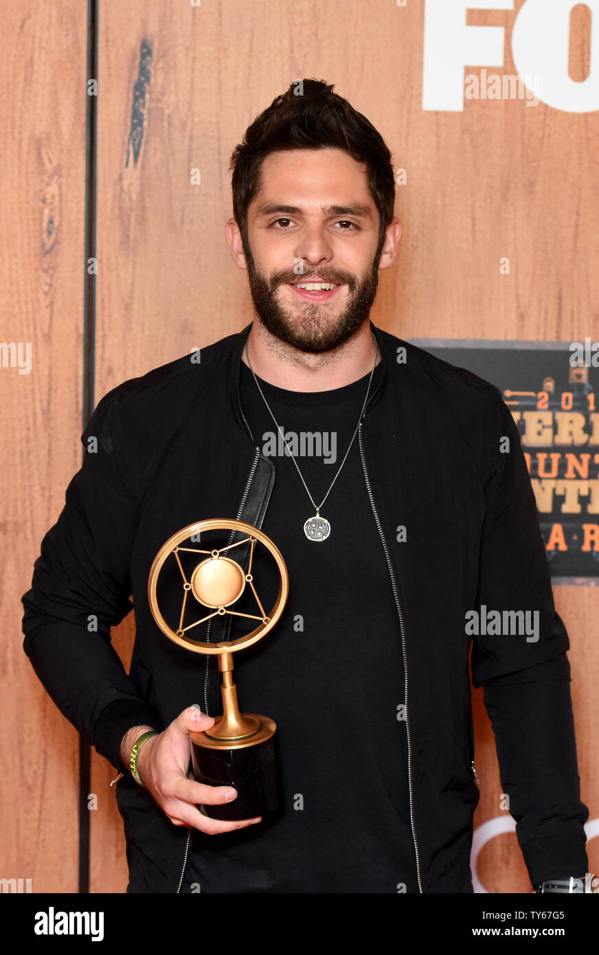 Singer Thomas Rhett winner of the award for 'Song of the Year,' poses ...