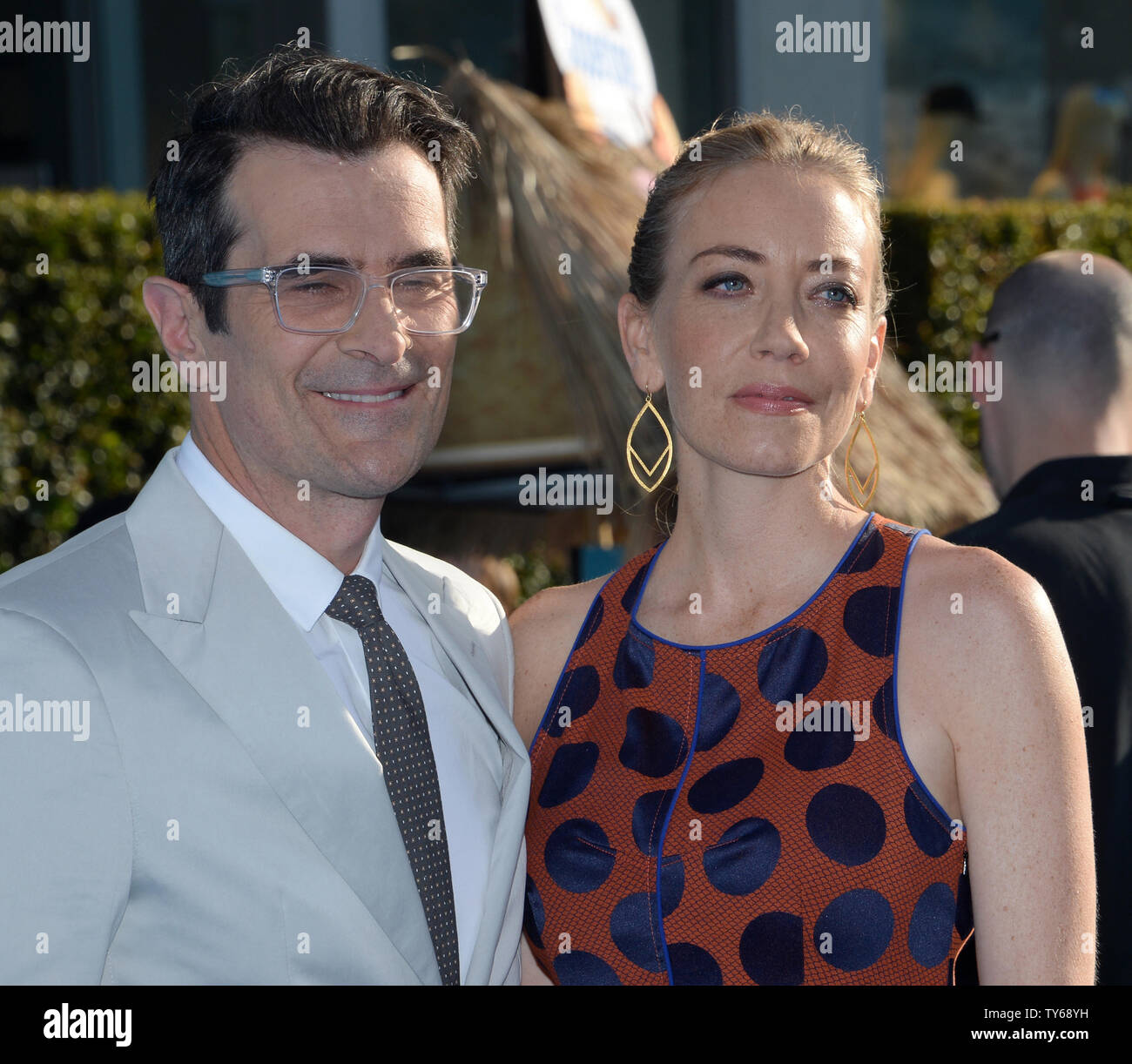Cast member Ty Burrell (L), the voice of Bailey and his wife Holly Anne ...