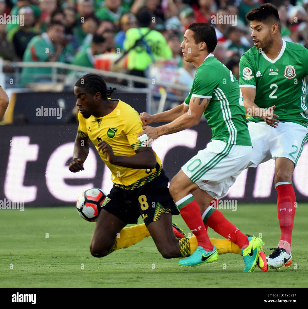 Jamaica's forward Clayton Donaldson (8) falls after a collision with ...