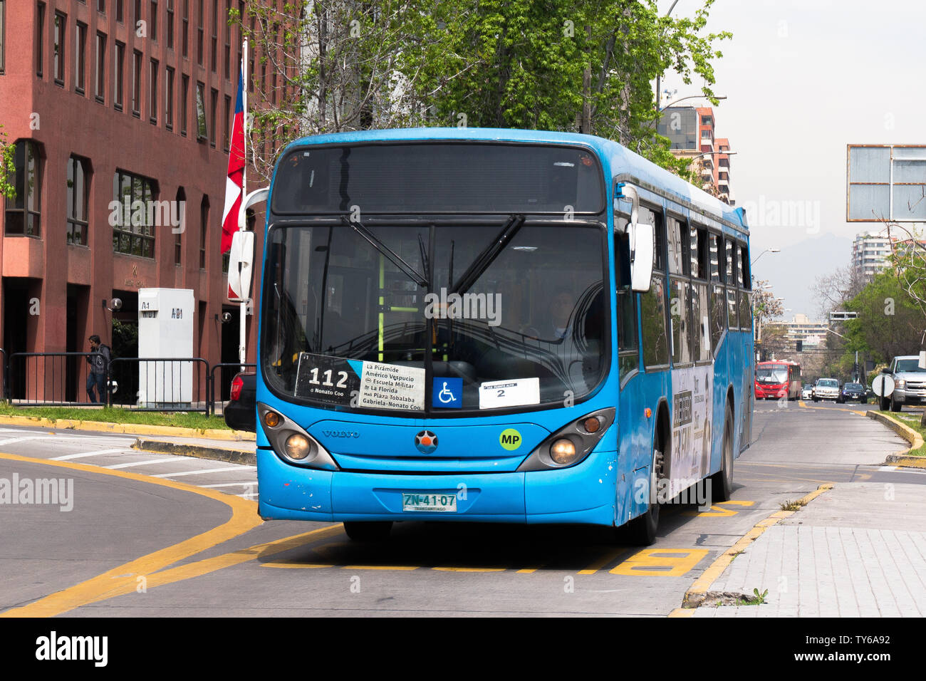 SANTIAGO, CHILE - OCTOBER 2015: A public transport bus near its next ...