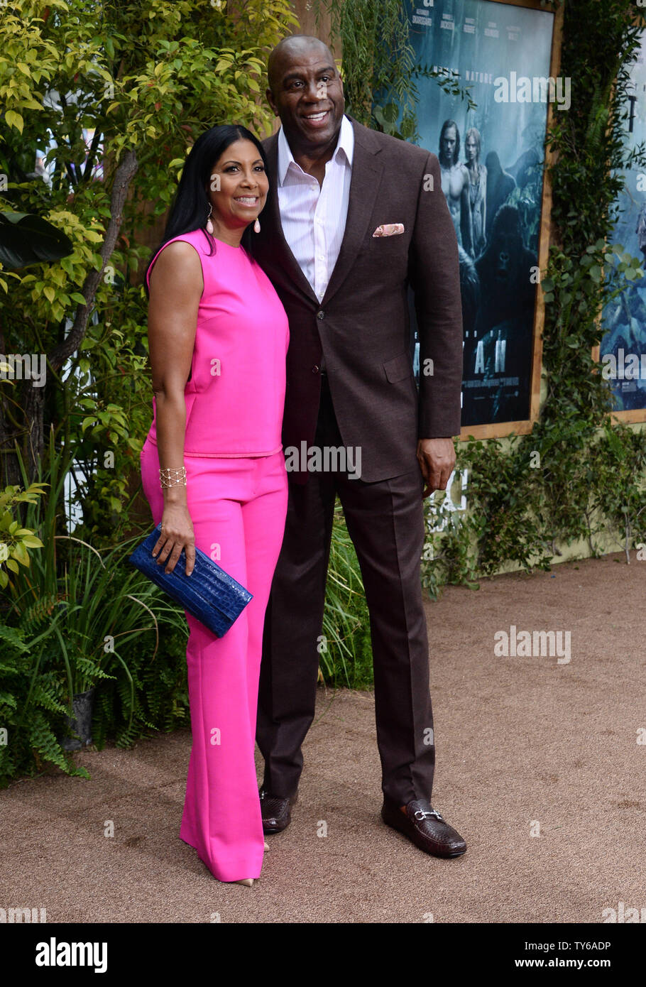 Former NBA player Earvin "Magic" Johnson (R) and his wife Earlitha ...