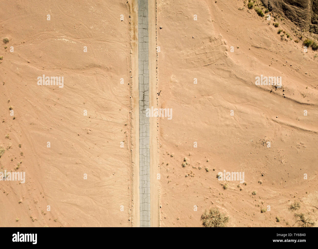 Old Desert road with cracked asphalt, Top down aerial image Stock Photo ...