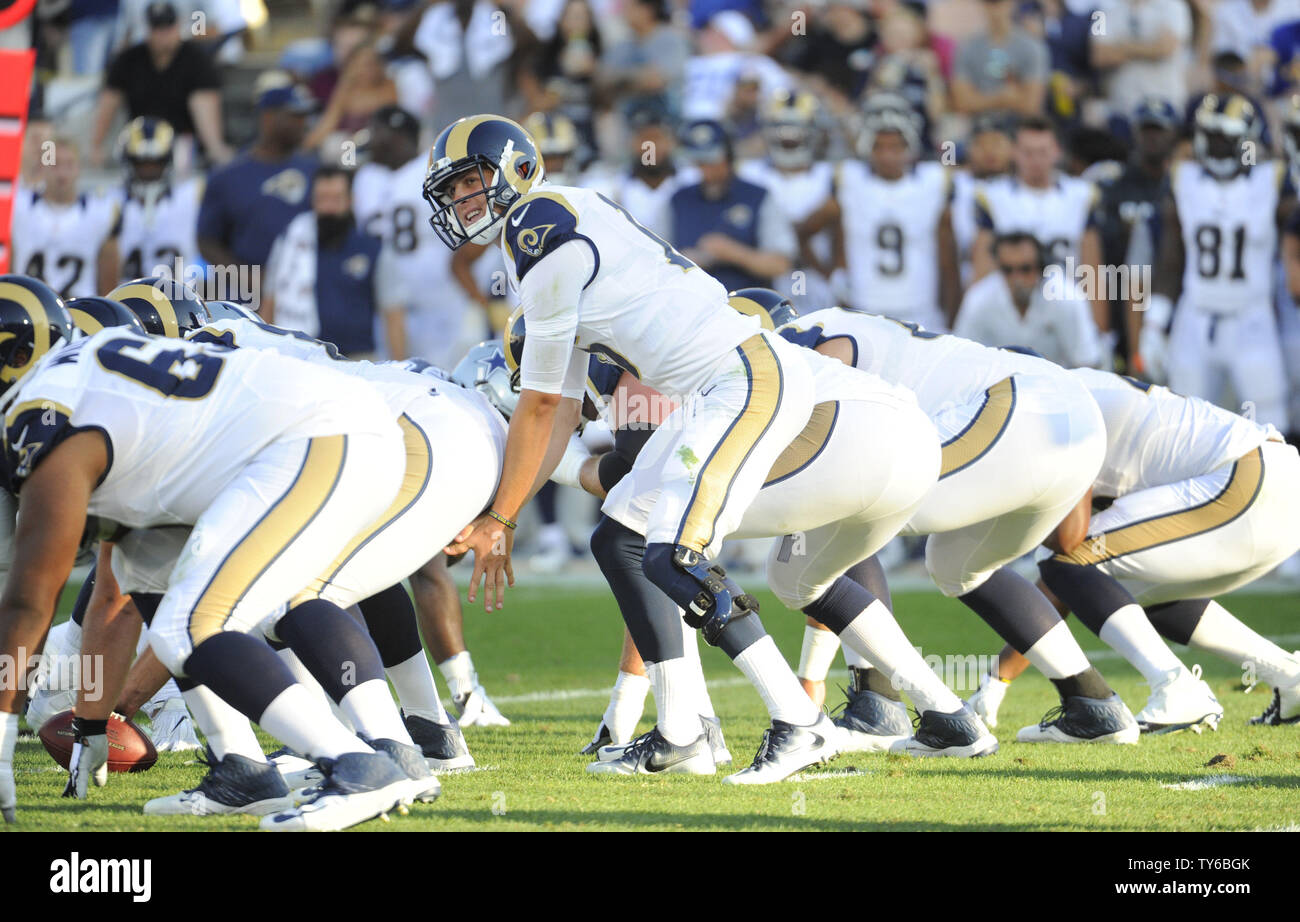 Los Angeles Rams quarterback Sean Mannion takes the snap against the ...