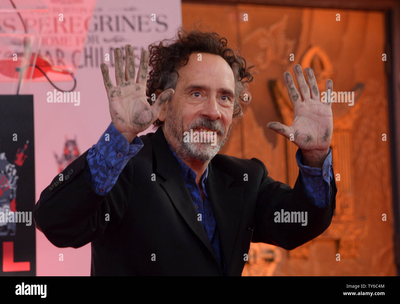 Director Tim Burton participates in a hand & footprint ceremony ...