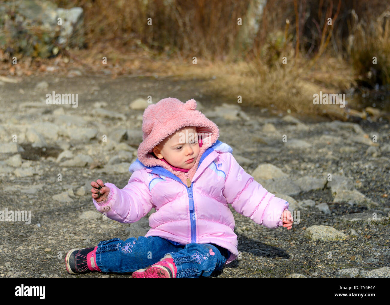 20 months old baby enjoying the nice weather outside. Toddler girl ...