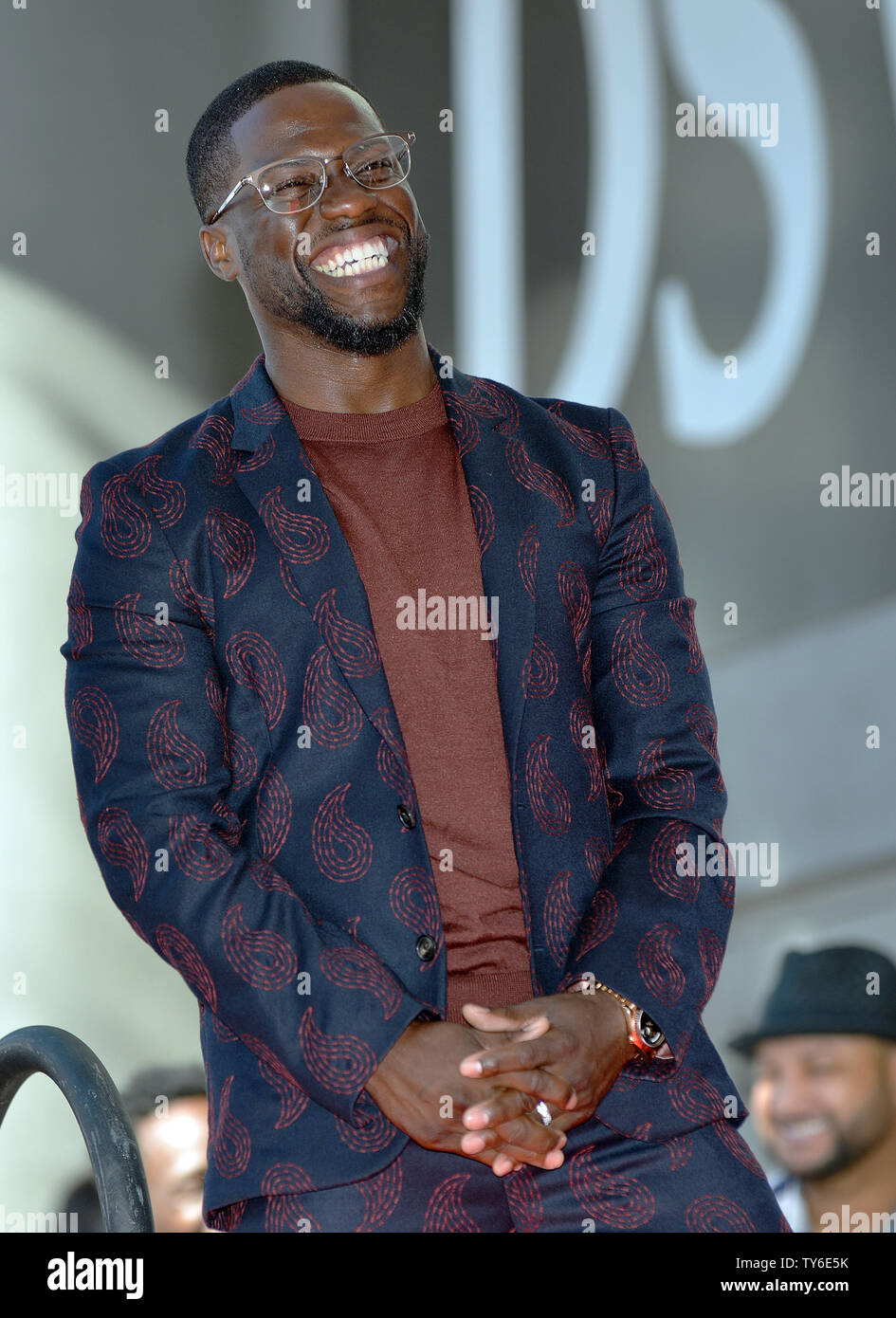 Actor Kevin Hart is all smiles at the ceremony honoring him with a star ...