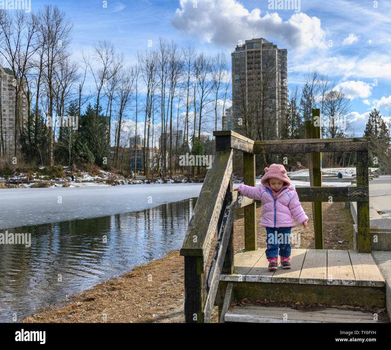 20 months old baby enjoying the nice weather outside. Toddler girl ...