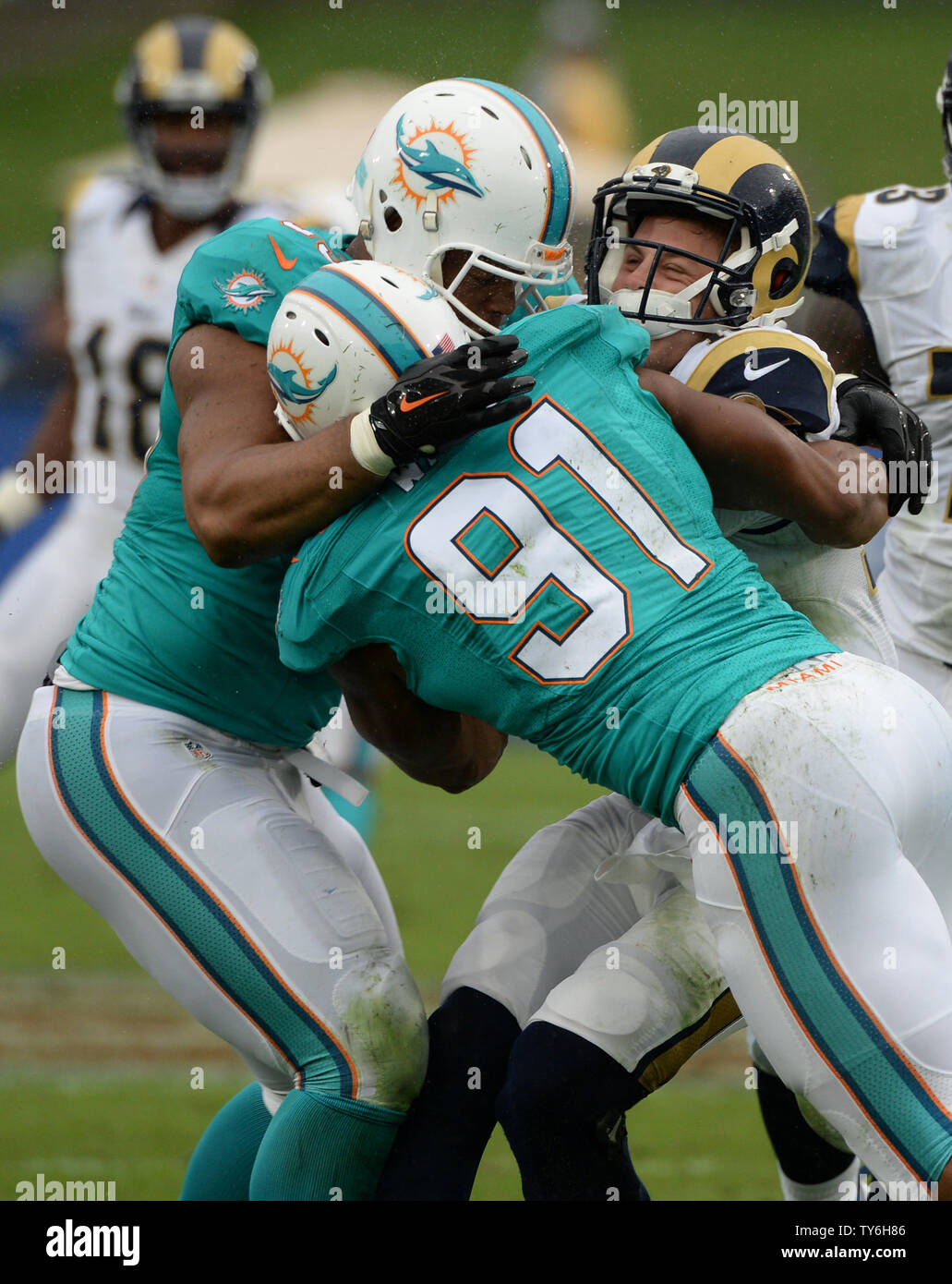 Los Angeles Rams quarterback Jared Goff (16) is sacked by Miami Dolphins Cameron Wake(91) and ...