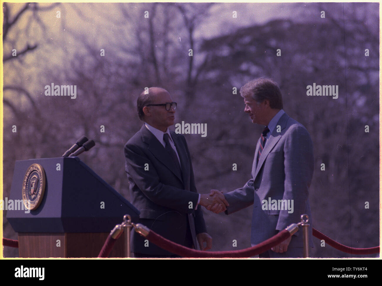 Jimmy Carter and Menahem Begin shake hands during a welcoming ceremony ...