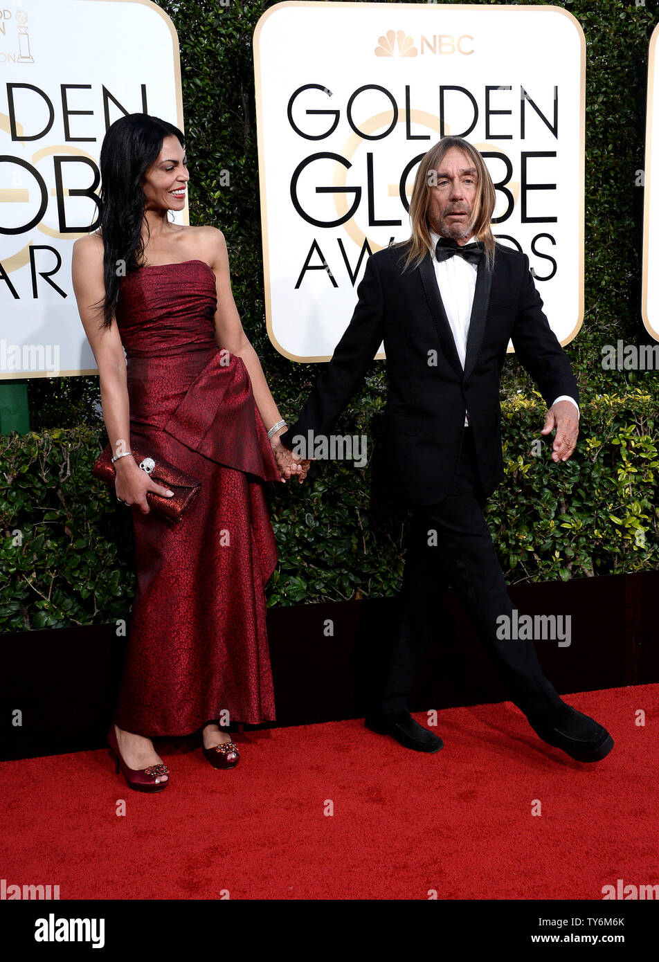 Iggy Pop (R) and Nina Alu attend the 74th annual Golden Globe Awards at ...