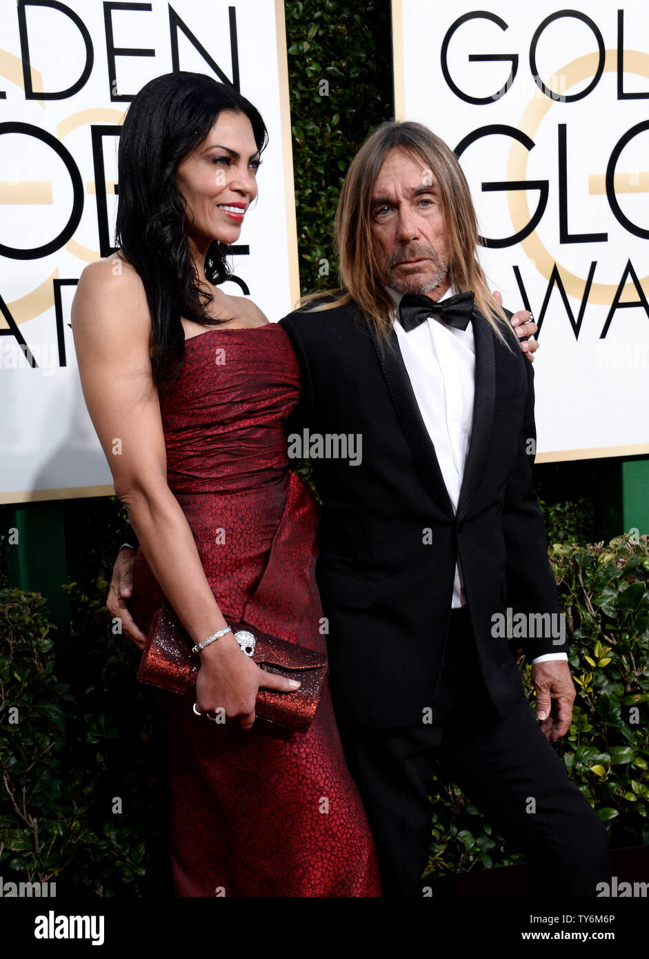 Iggy Pop (R) and Nina Alu attend the 74th annual Golden Globe Awards at ...
