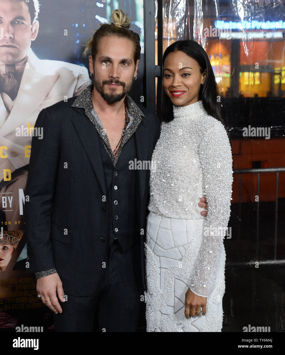 Actress Zoe Saldana and Italian artist Marco Perego attend the premiere ...