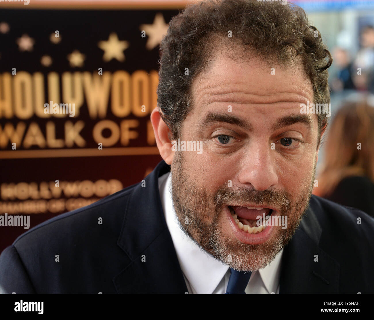 Director Brett Ratner speaks with reporters following an unveiling ...