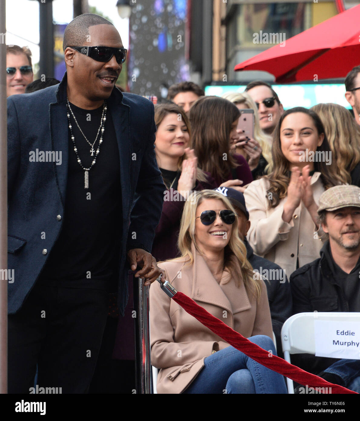 Actor Eddie Murphy (L) is introduced while Murphy's girlfriend ...