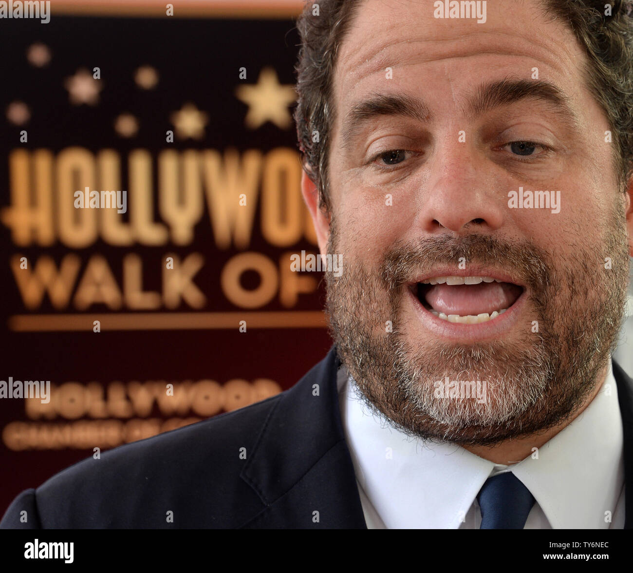 Director Brett Ratner speaks with reporters following an unveiling ...