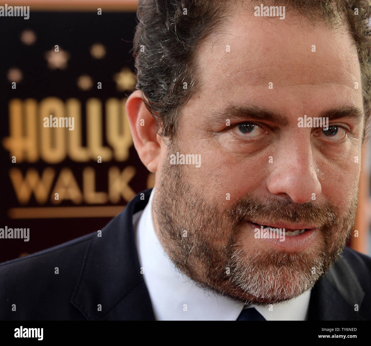 Director Brett Ratner speaks with reporters following an unveiling ...