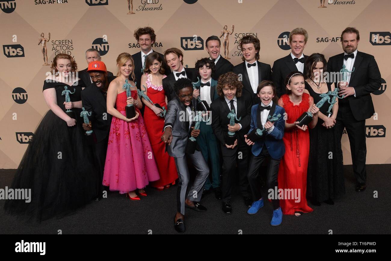 Cast members of "Stranger Things" appear backstage with their award for ...