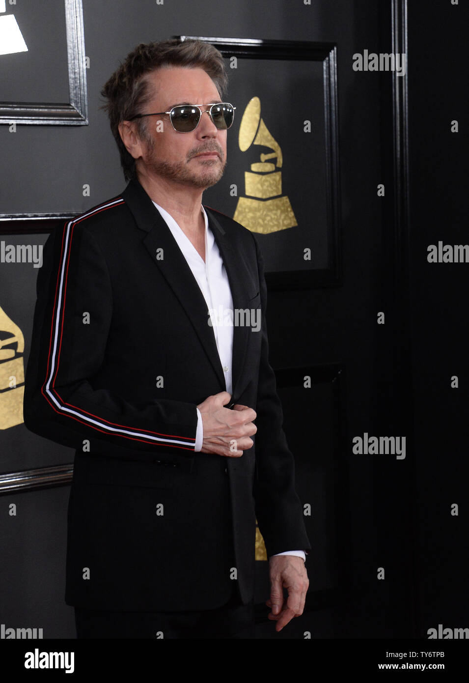Composer Jean-Michel Jarre arrives for the 59th annual Grammy Awards ...