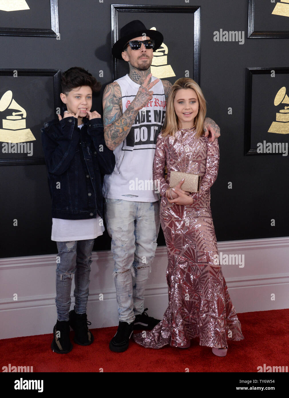 Musician Travis Barker of Blink-182 with children Alabama Barker and ...