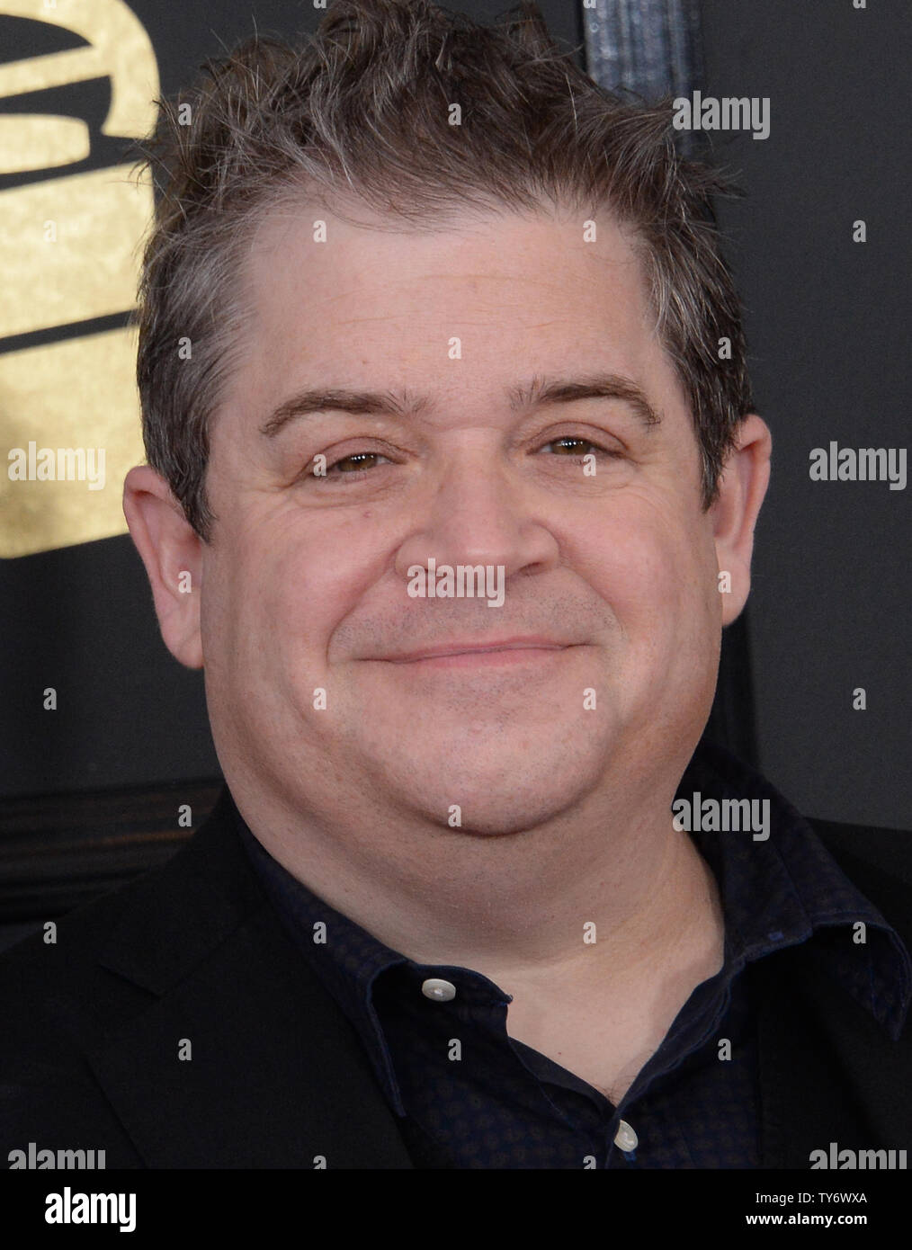 Comedian Patton Oswalt arrives for the 59th annual Grammy Awards held ...