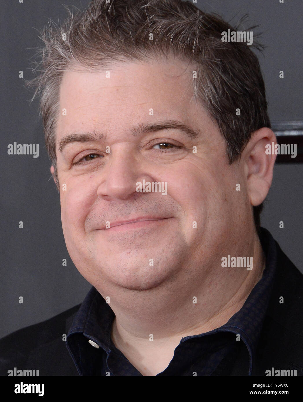 Comedian Patton Oswalt arrives for the 59th annual Grammy Awards held ...