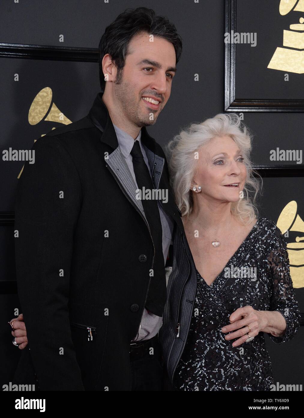 (L-R) Singer/songwriters Ari Hest and Judy Collins arrive for the 59th ...