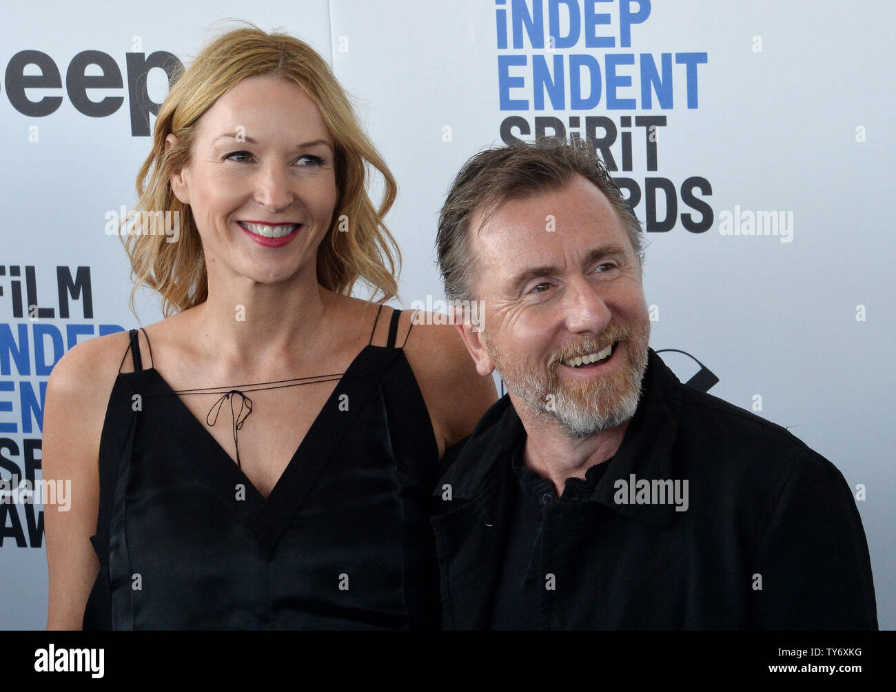 Actor Tim Roth (R) and Nikki Butler attend the 32nd annual Film ...