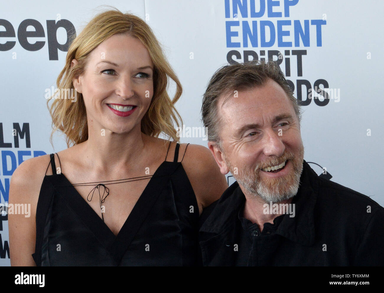 Actor Tim Roth (R) and Nikki Butler attend the 32nd annual Film ...