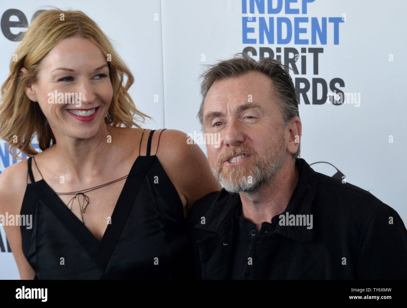 Actor Tim Roth (R) and Nikki Butler attend the 32nd annual Film ...