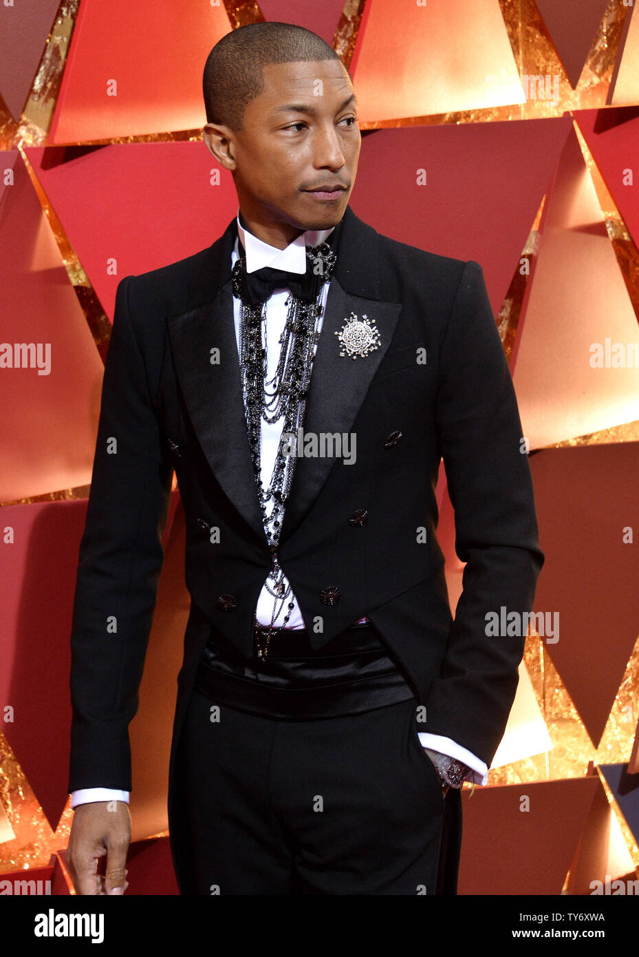 Musician Pharrell Williams arrives on the red carpet for the 89th ...