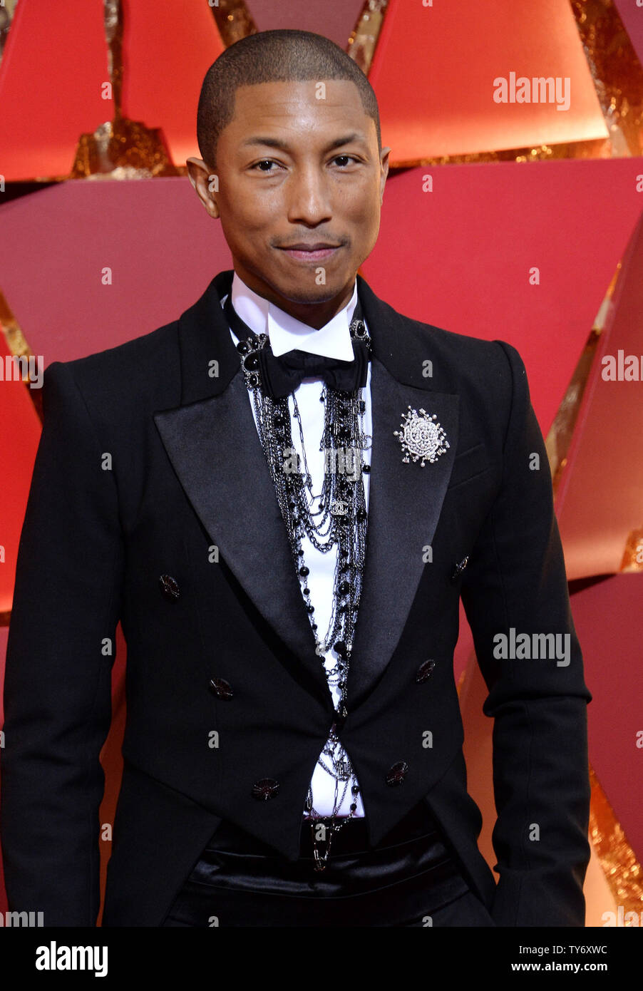 Musician Pharrell Williams arrives on the red carpet for the 89th ...