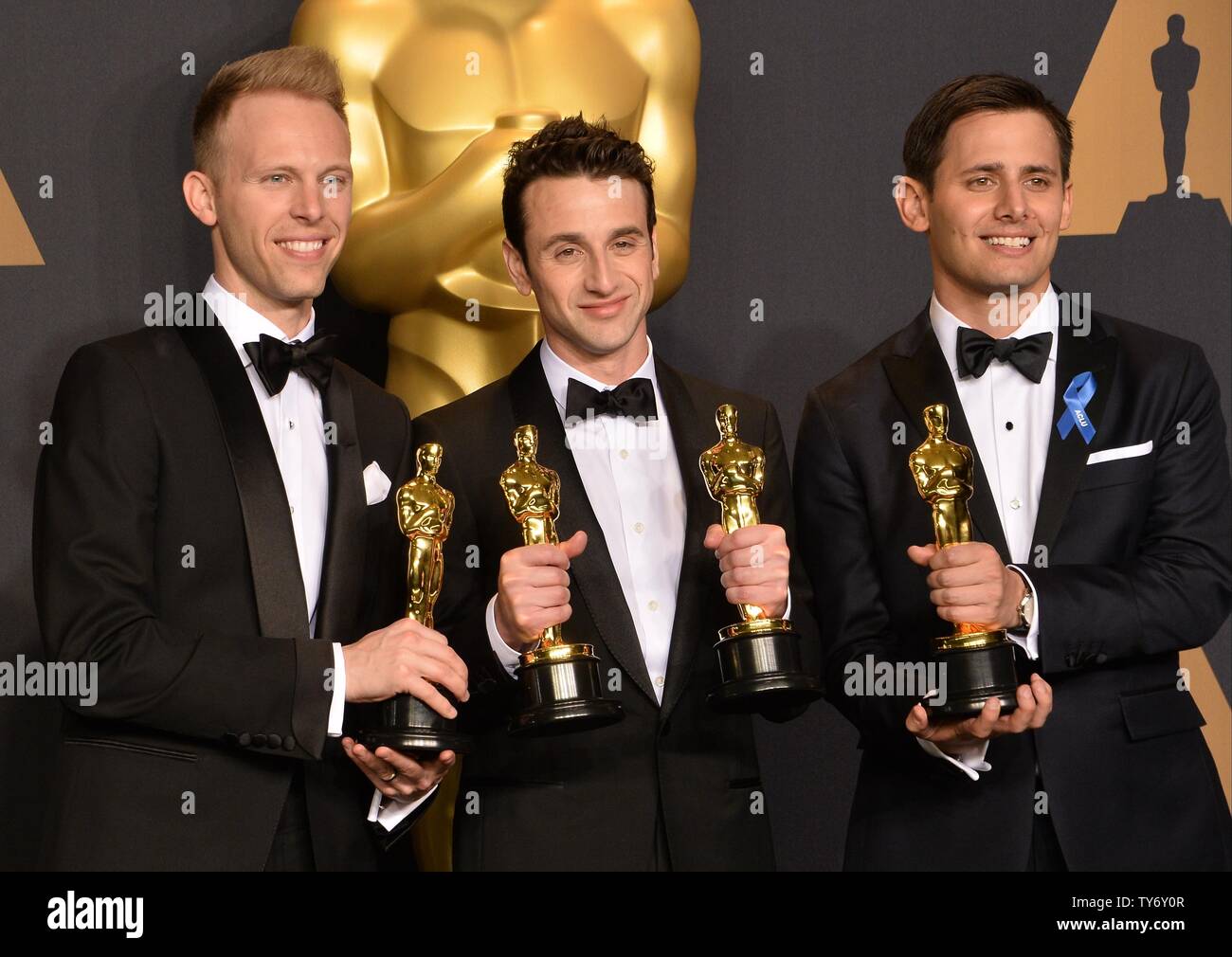 (L-R) Composers Justin Paul, Justin Hurwitz and Benj Pasek, winners of the award for Music ...
