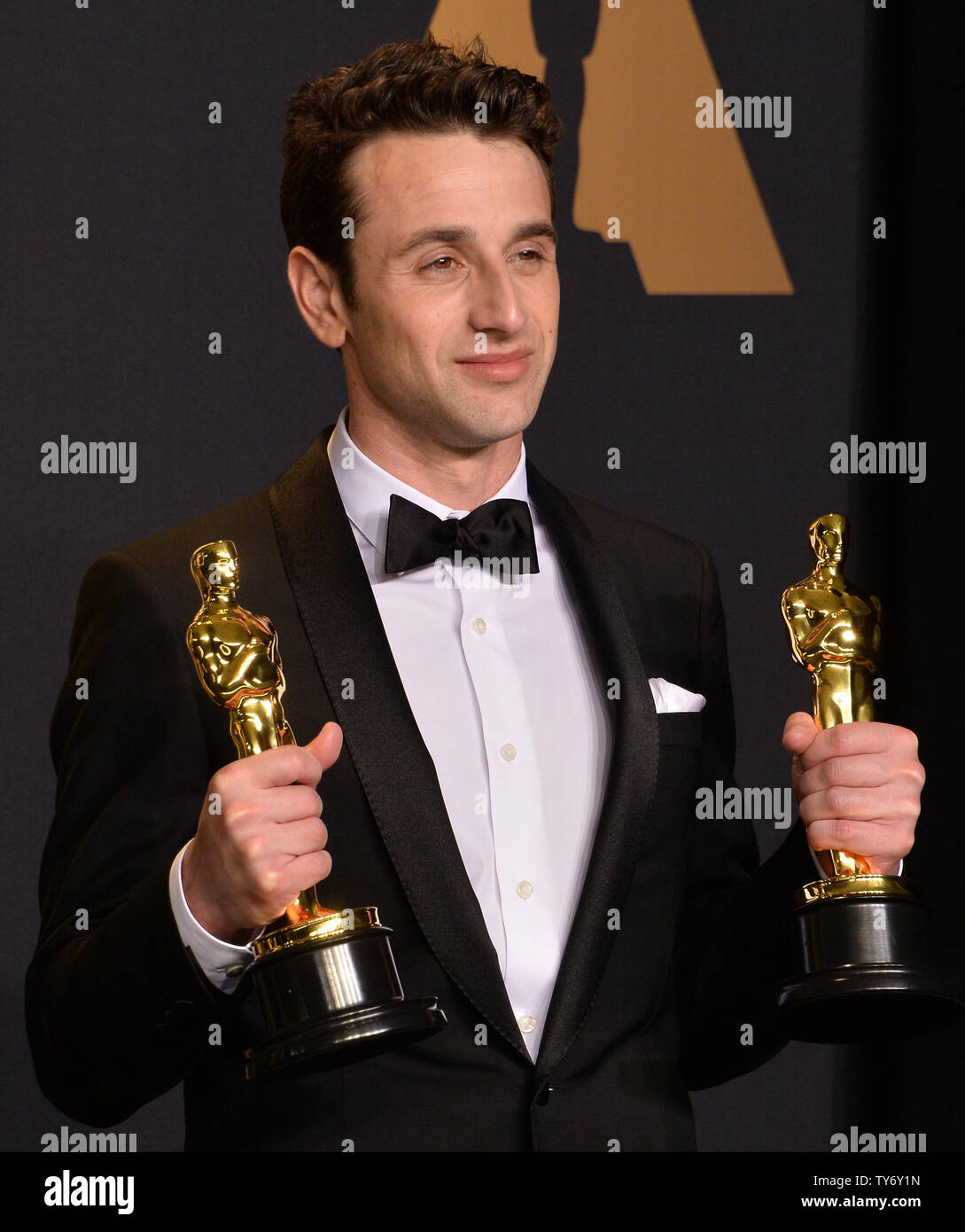 Justin Hurwitz holds his Oscars Best Score and Best Song for 'La La ...