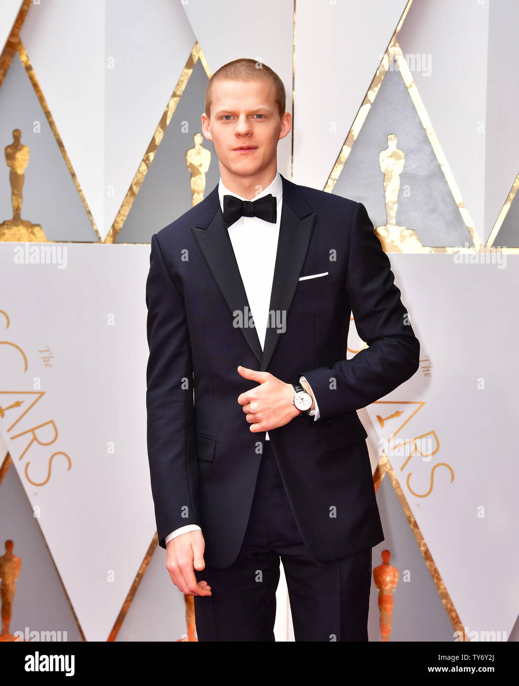 Actor Lucas Hedges arrives with an assortment of Oscar-themed food on ...