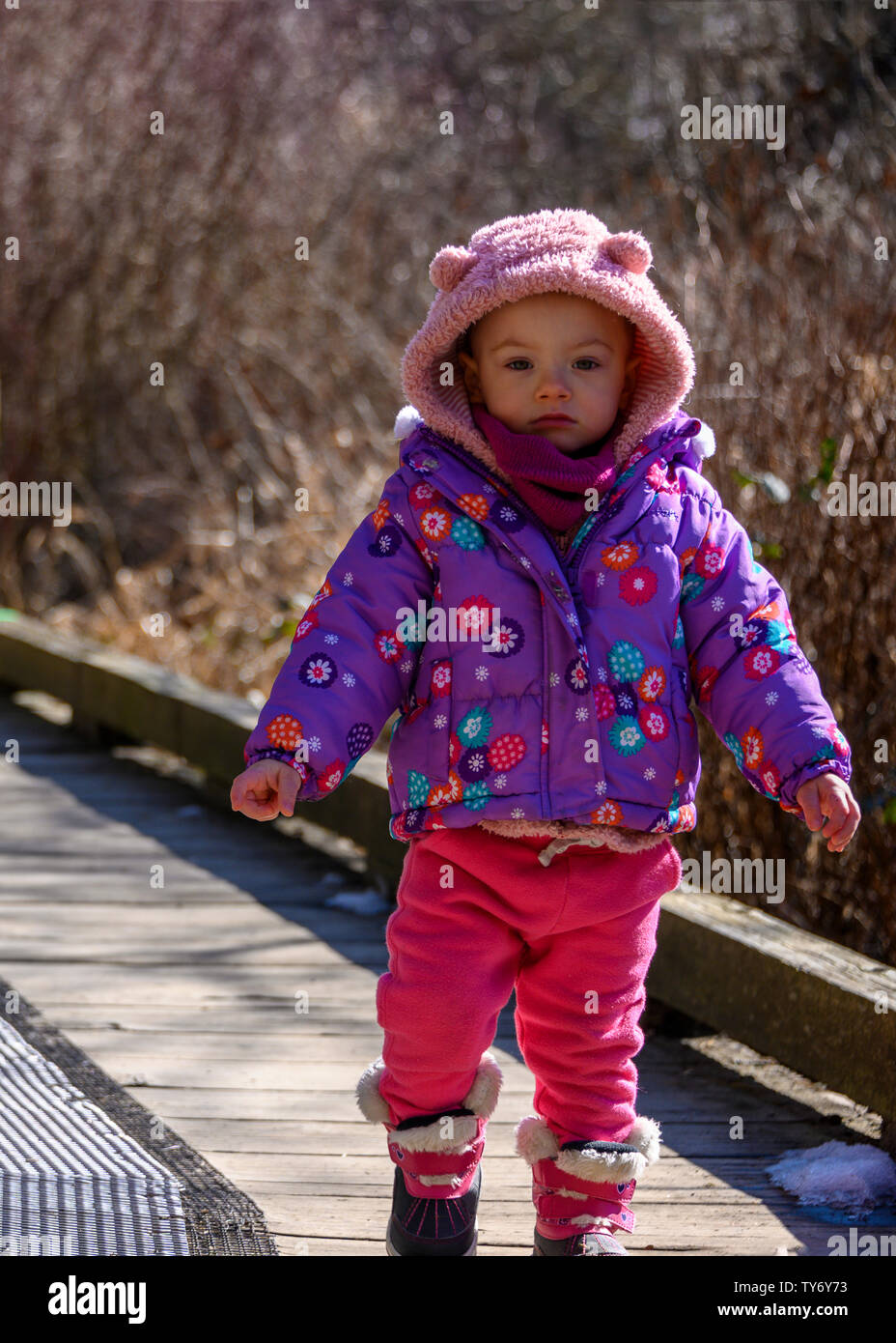 20 months old baby enjoying the nice weather outside. Toddler girl ...