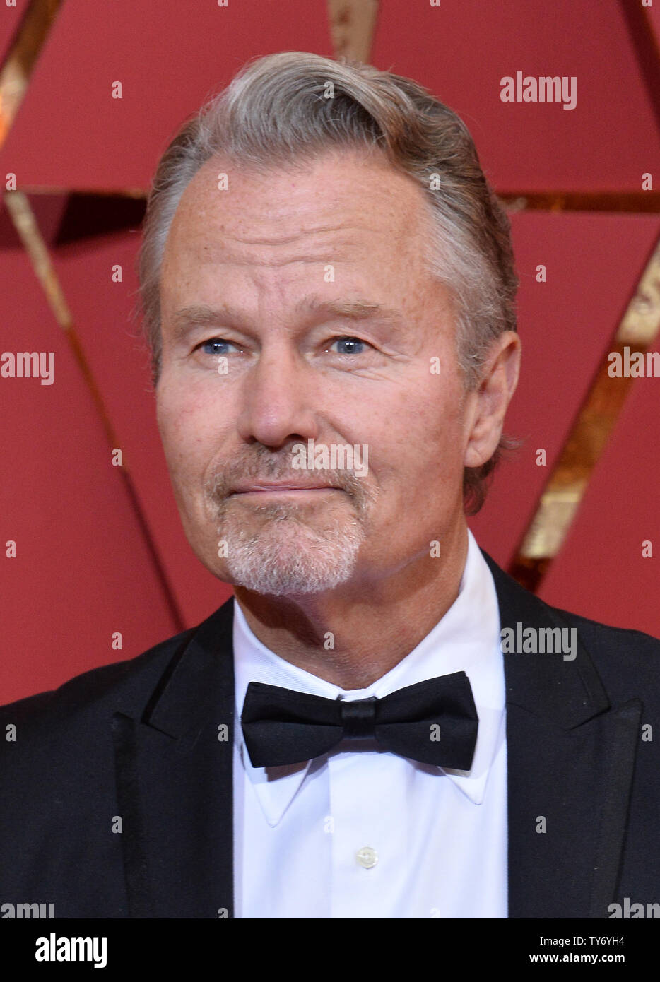 Actor John Savage arrives on the red carpet for the 89th annual Academy ...
