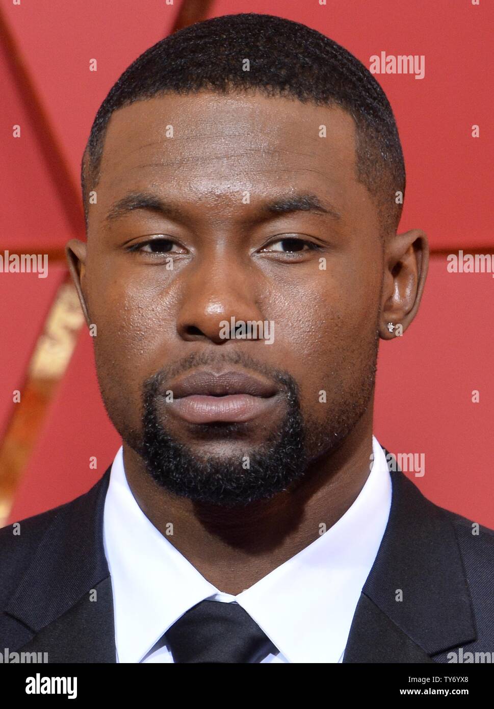 Actor Trevante Rhodes arrives on the red carpet for the 89th annual ...