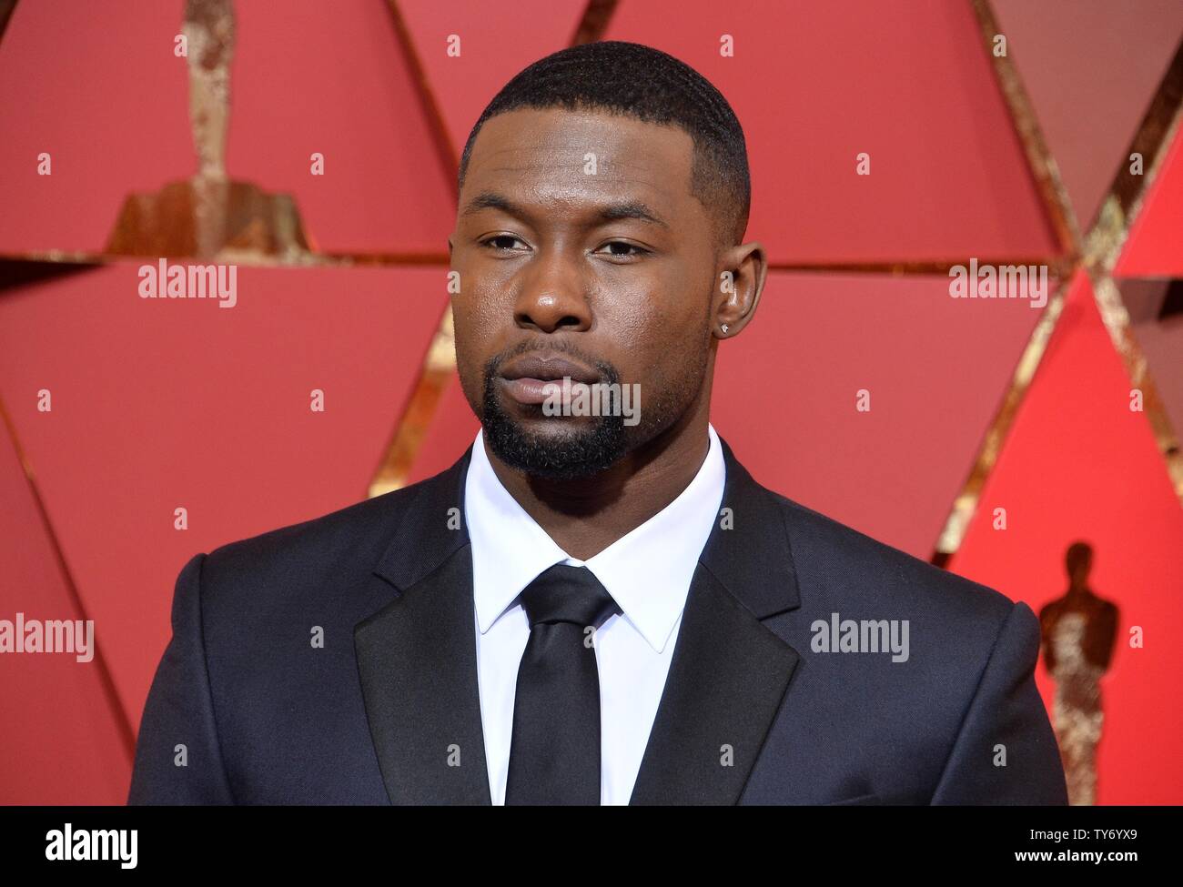 Actor Trevante Rhodes arrives on the red carpet for the 89th annual ...