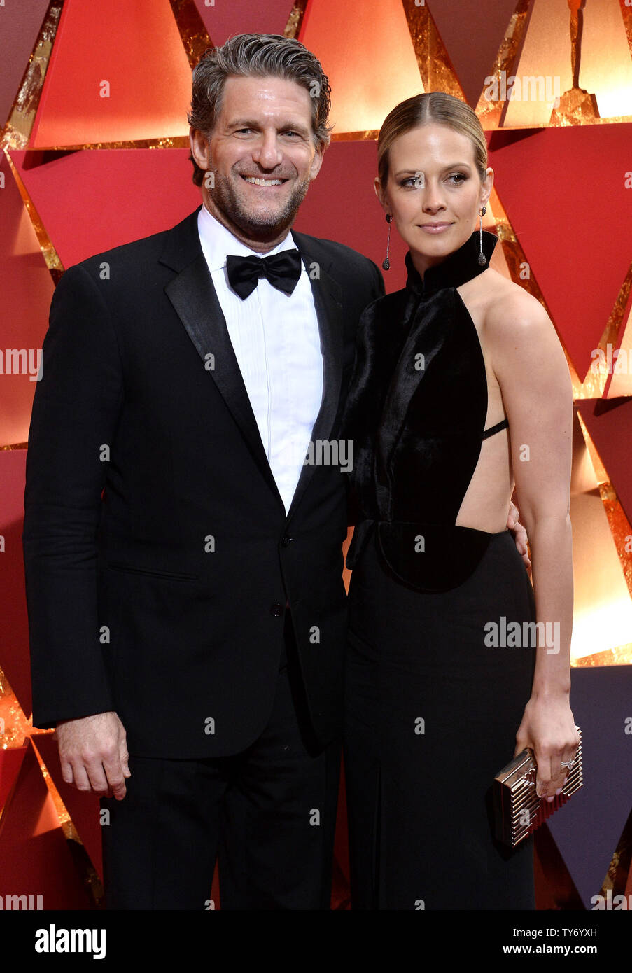 Producer Gary Gilbert and Charlotte Gilbert arrive on the red carpet ...